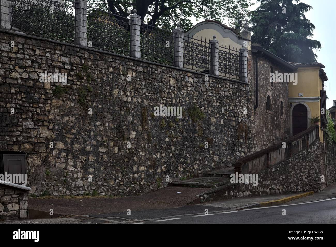 Stone fortification and a staircase that leads to a house by the edge ...