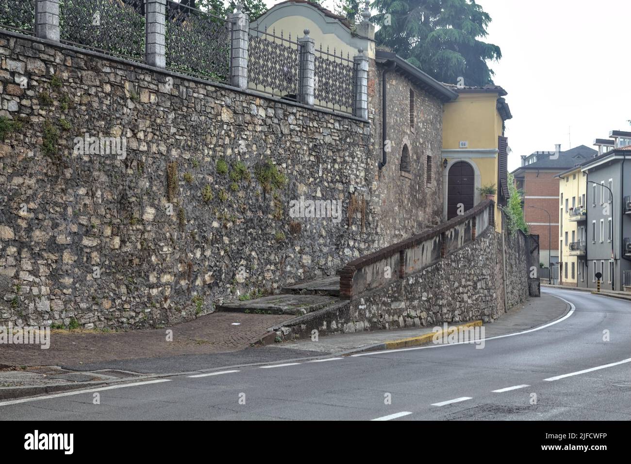 Stone fortification and a staircase that leads to a house by the edge ...