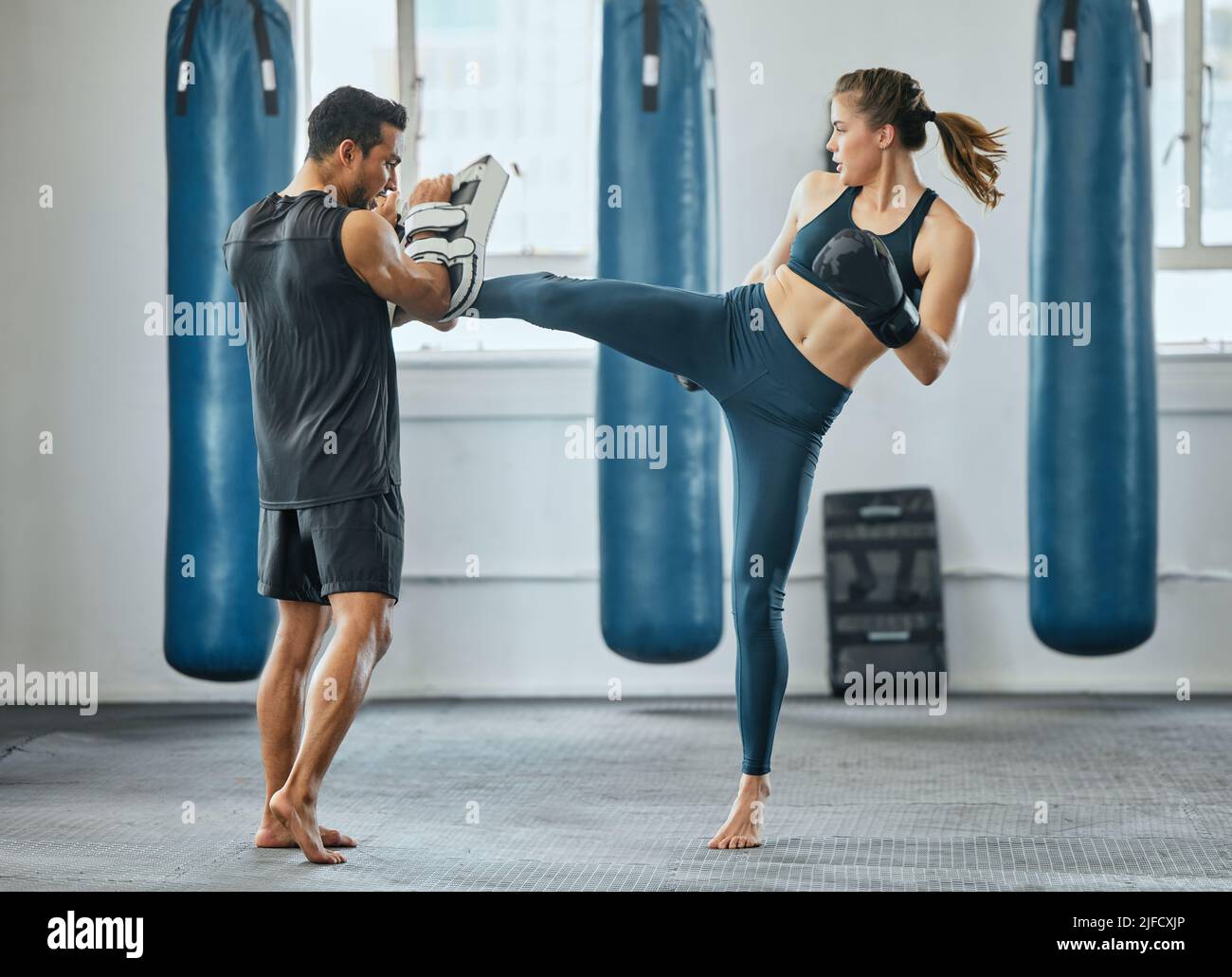 . Female kickboxer training with a man at gym Stock Photo - Alamy
