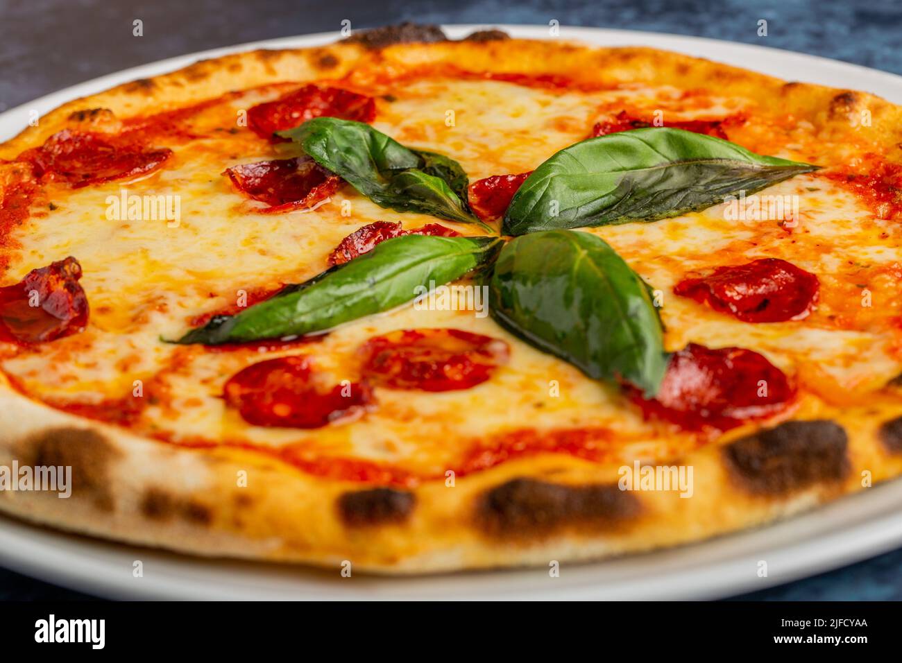 A serving of fresh pepperoni pizza Stock Photo - Alamy