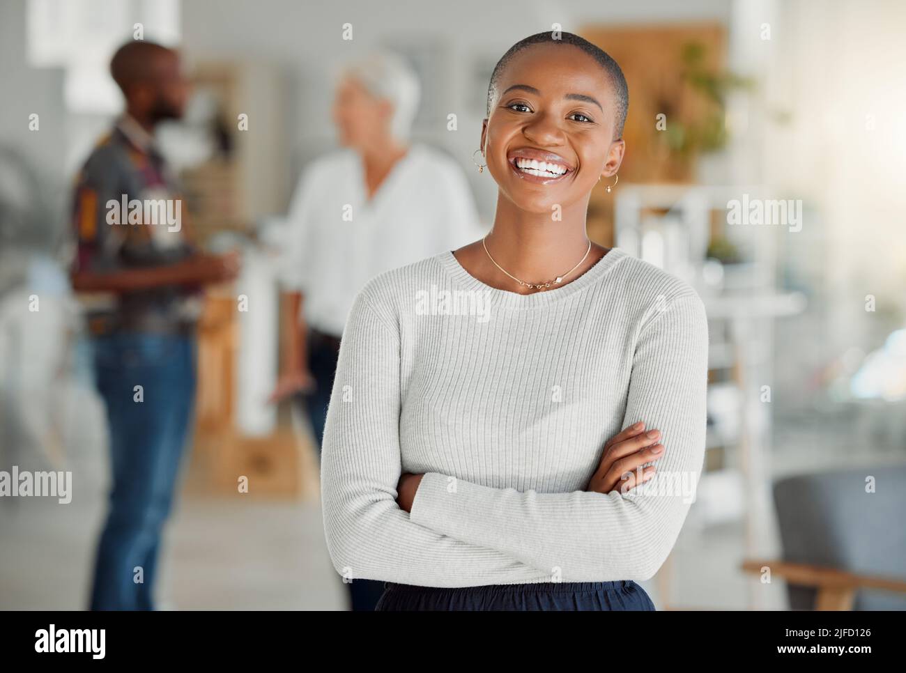 Portrait of a happy African american businesswoman standing with her ...