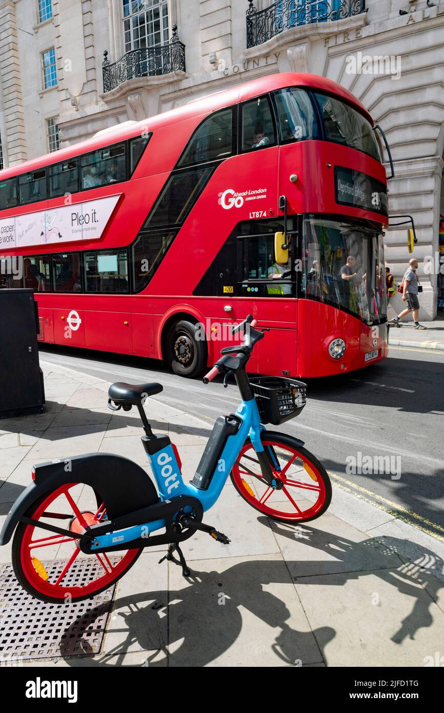 Dott Electric E bike available to hire in the West End of London a double decker London Bus ...