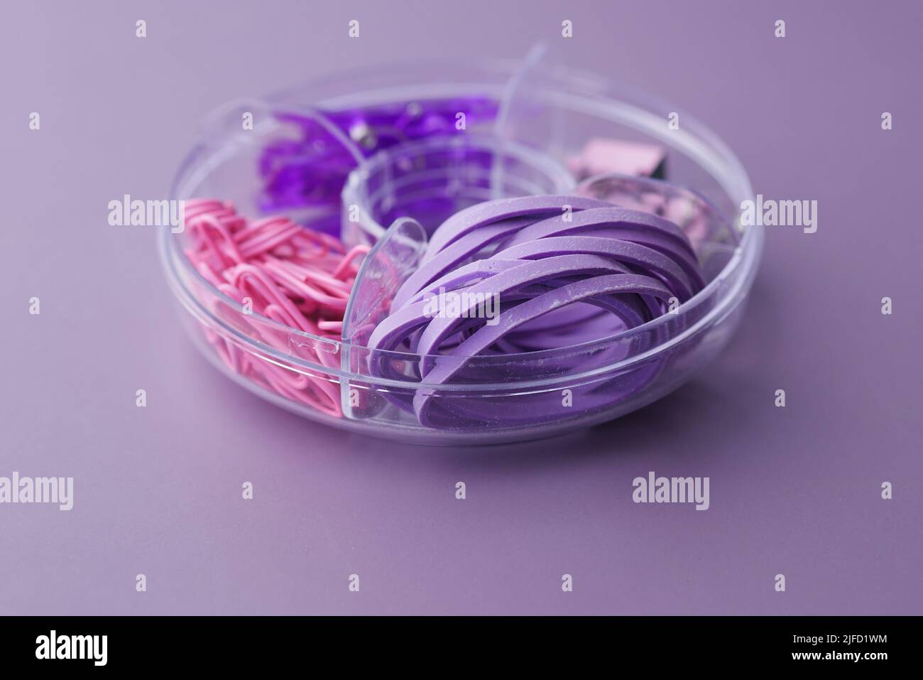 purple color office stationary in a plastic box Stock Photo - Alamy