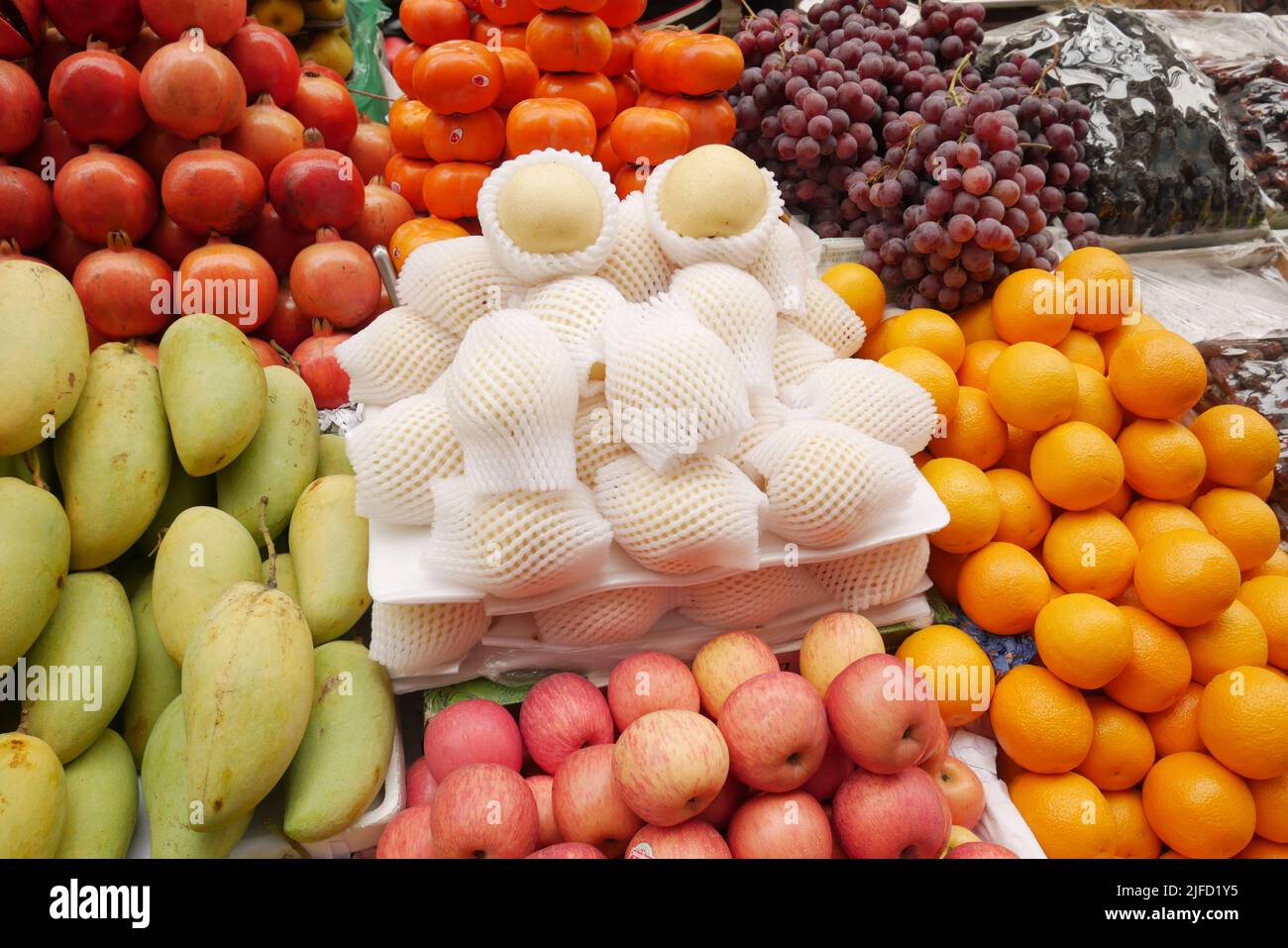mixed fruit display for sale at local store Stock Photo - Alamy