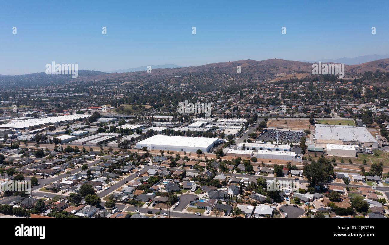 Day time aerial view of the industrial warehousing and residential ...