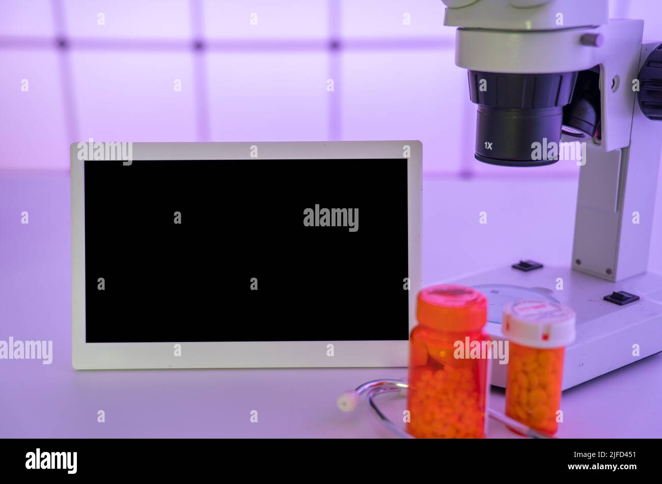computer tablet screen with blank space for text next to microscope in ...