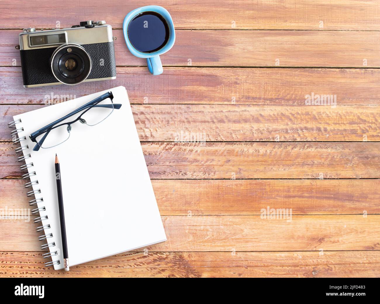 Top view of wooden table with office supplies. Office desk table with ...