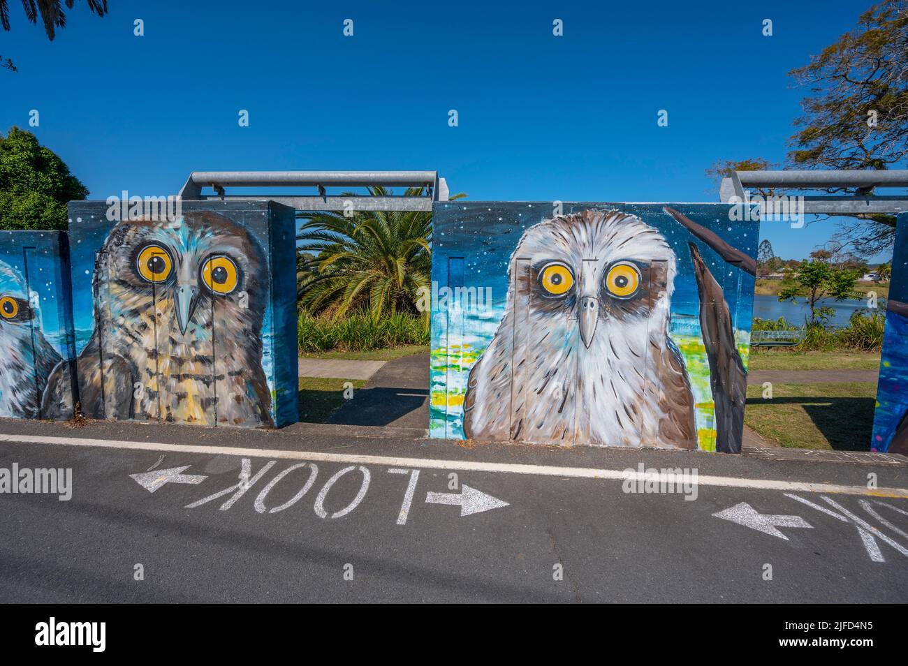 animal and bird and owl mural on concrete flood protection wall in ...