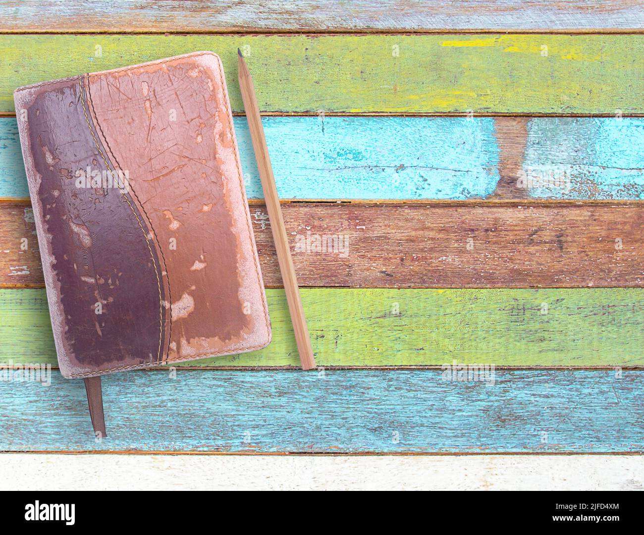 Old notebooks and pencil on business wooden table or office desk top ...