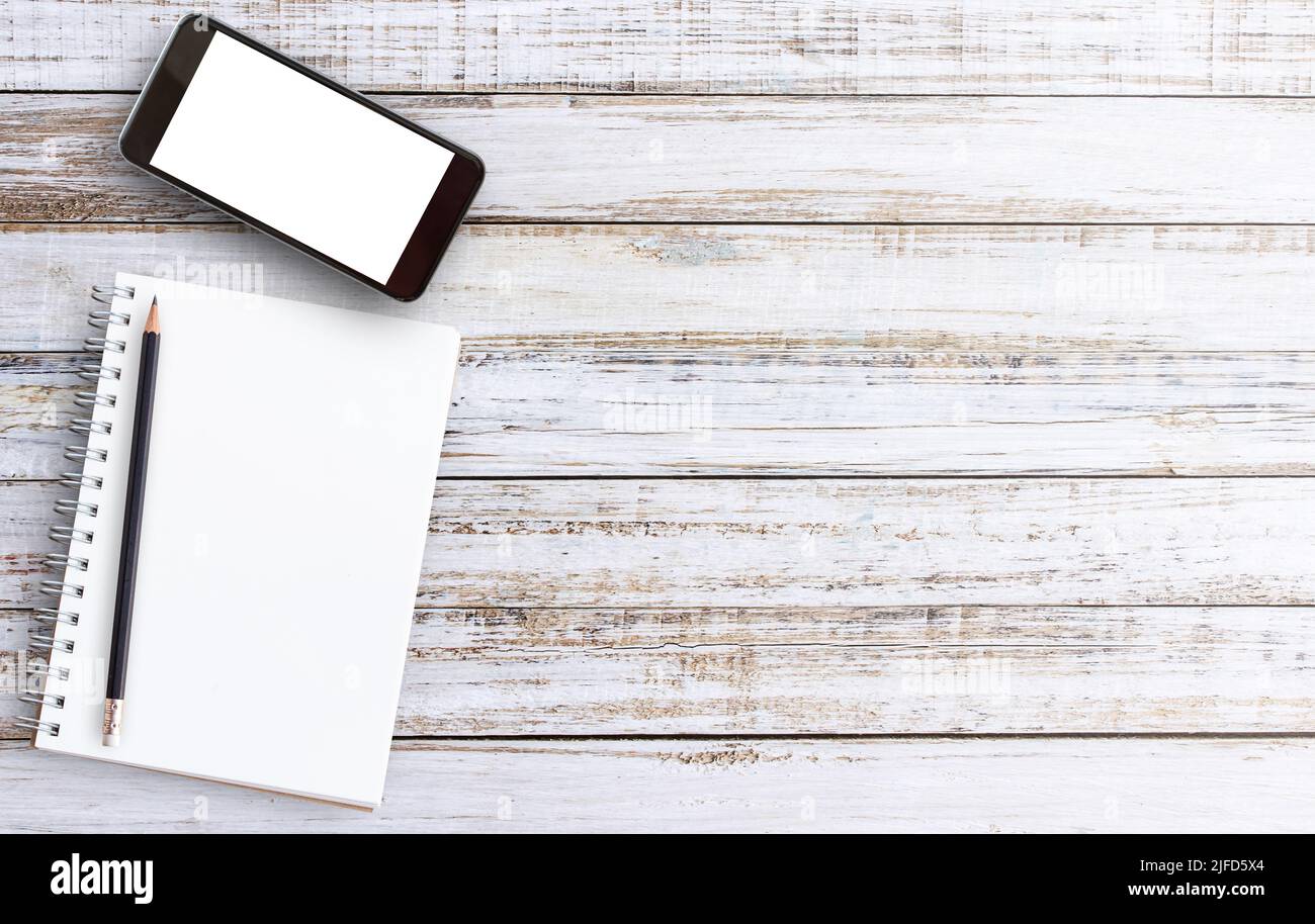 Flat lay, close up clean open notebook,smart phone on top of wooden ...