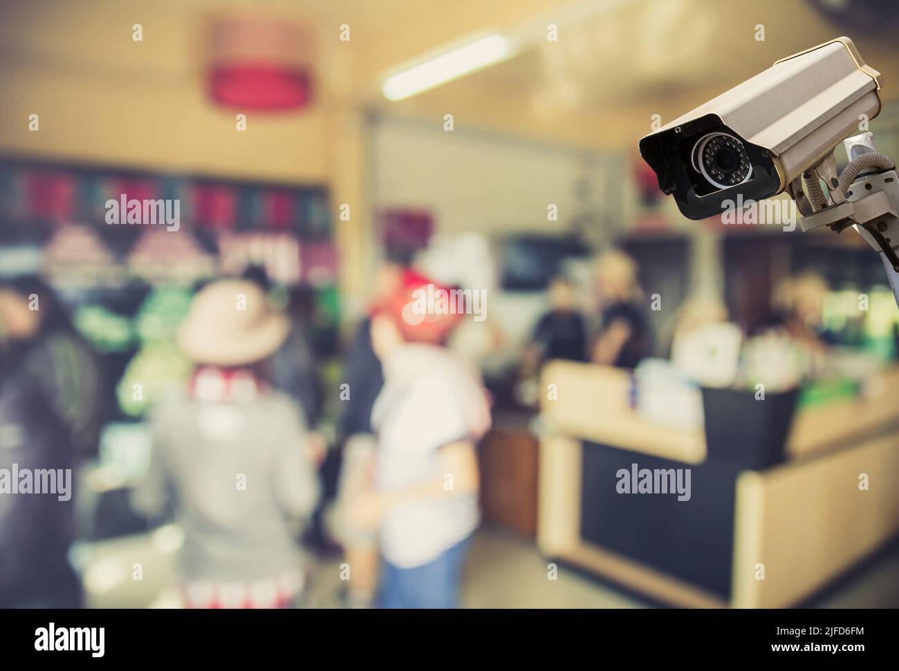 Image of CCTV security camera on blurred coffee shop background ...