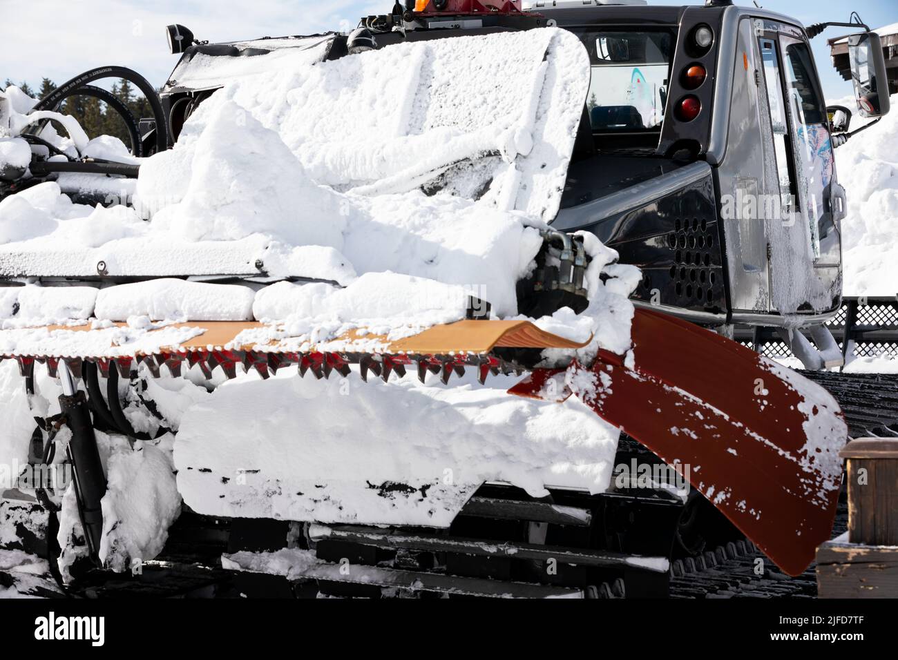 Snow grooming machine preparing ski slope at ski resort Stock Photo - Alamy