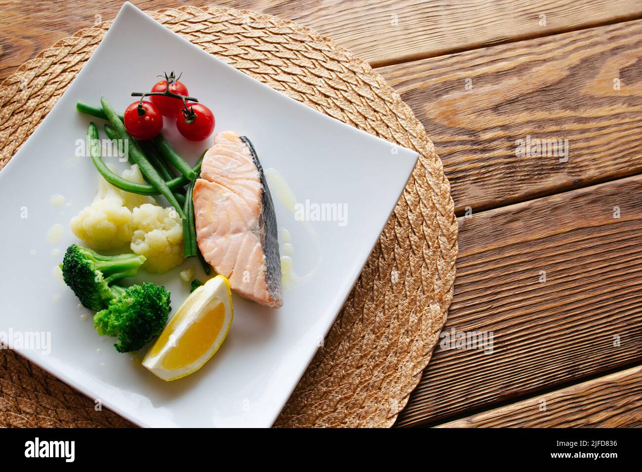 Dietary food. Salmon steak with vegetables Stock Photo - Alamy