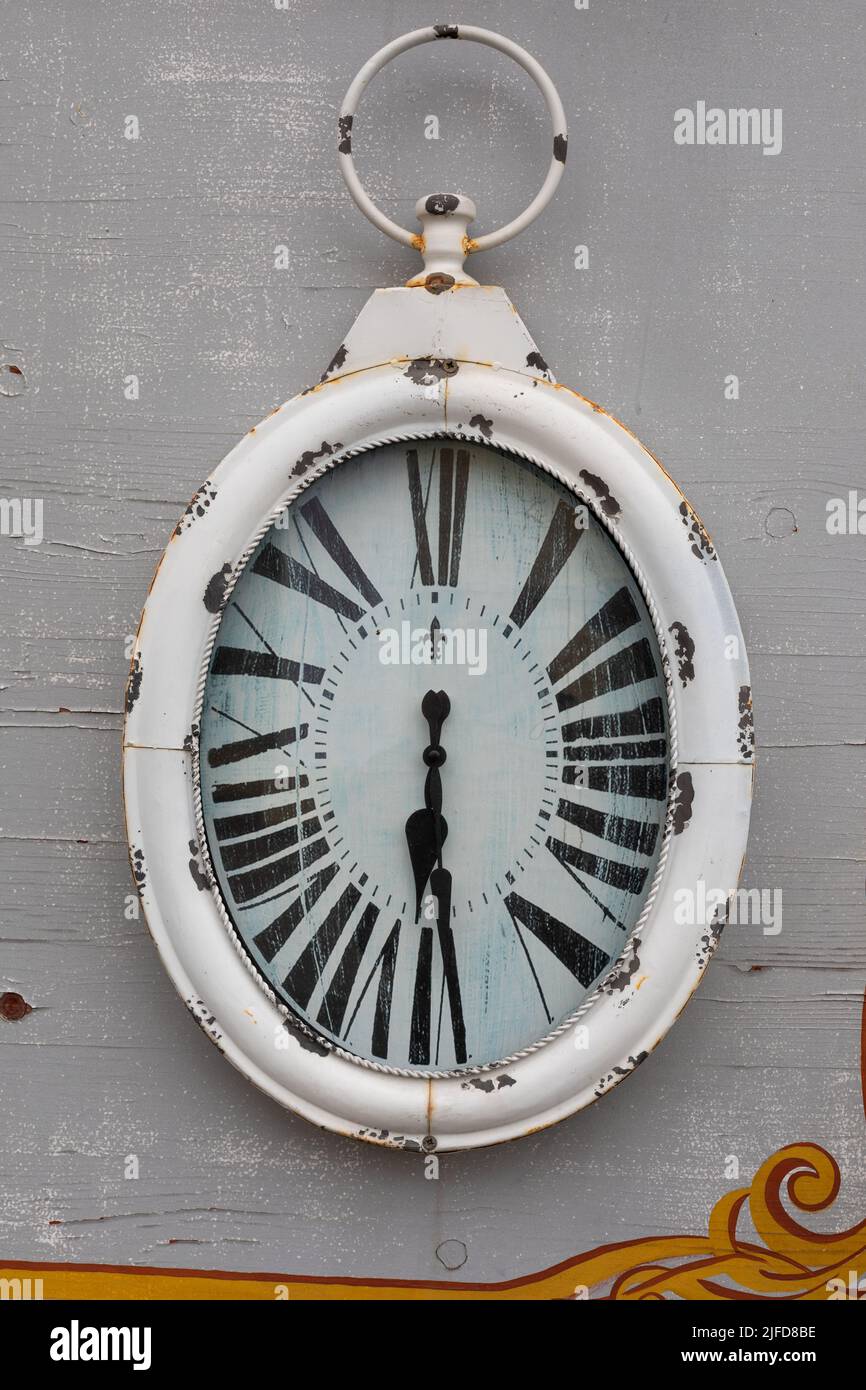 Rusty vintage clock hanging on a grai wall Stock Photo - Alamy