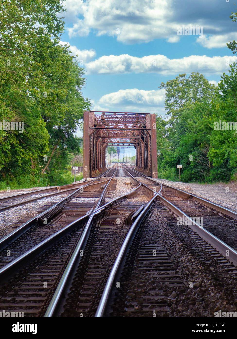 A train railway passing through the steel bridge Stock Photo - Alamy