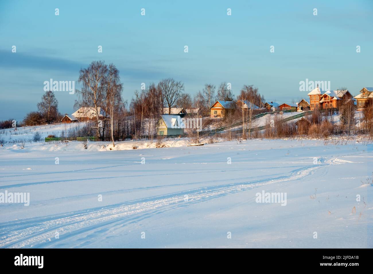 Traces of vehicles and people on the frozen and snow-covered Volga ...