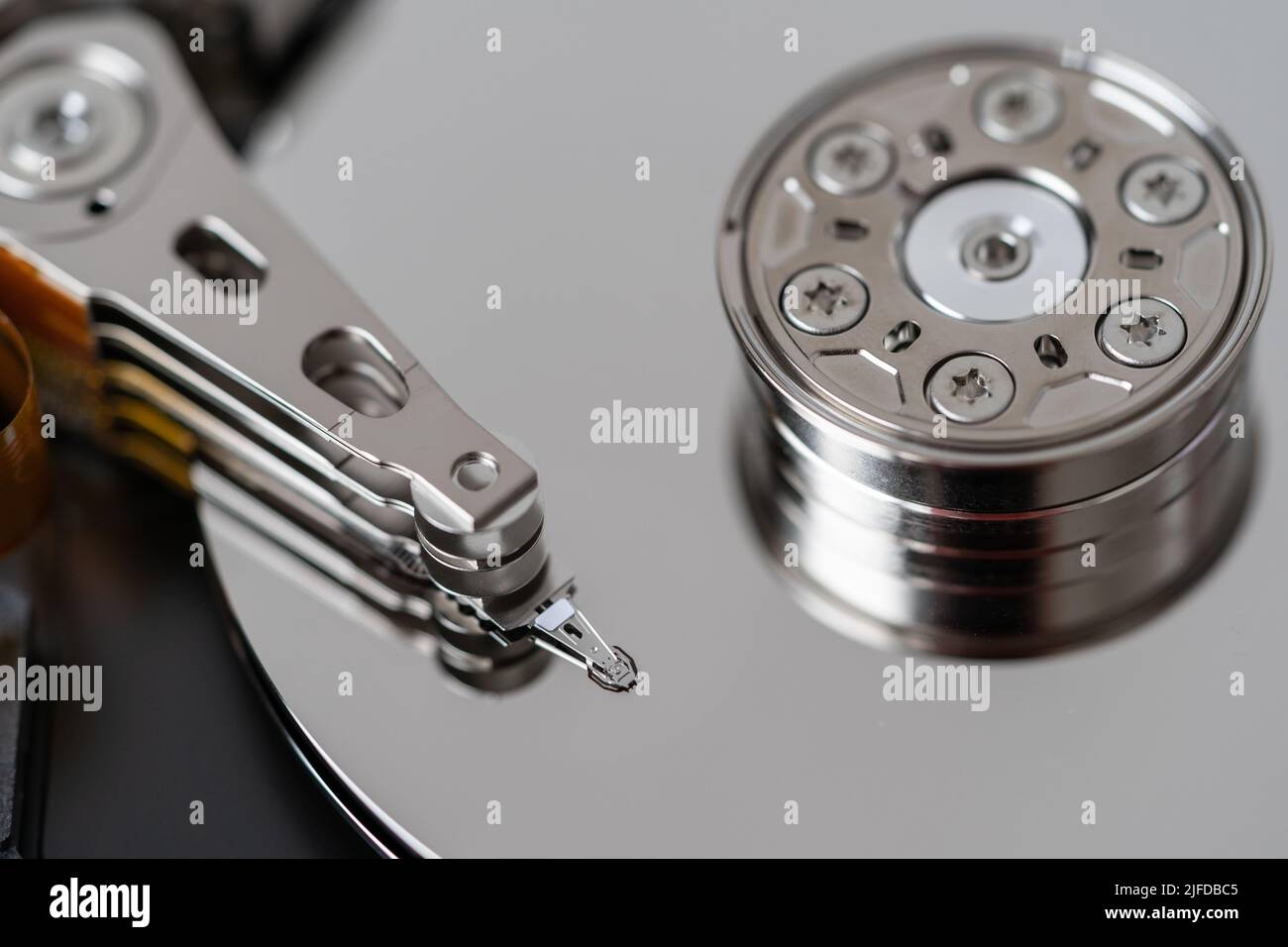 Opened hard disk after disassembly during repair or service, macro shot ...