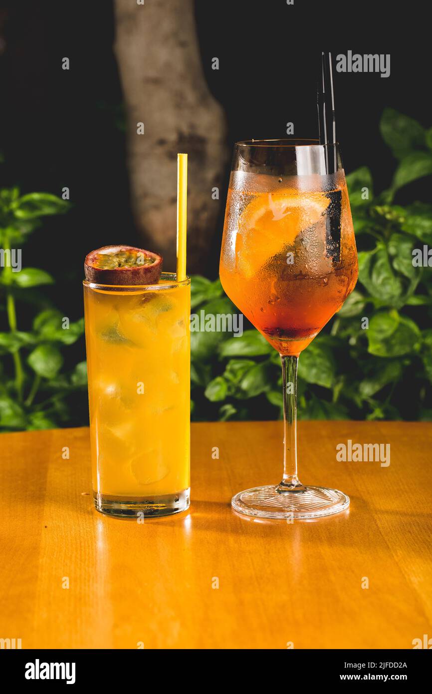 A vertical shot of two glasses of cocktails on bar counter Stock Photo ...