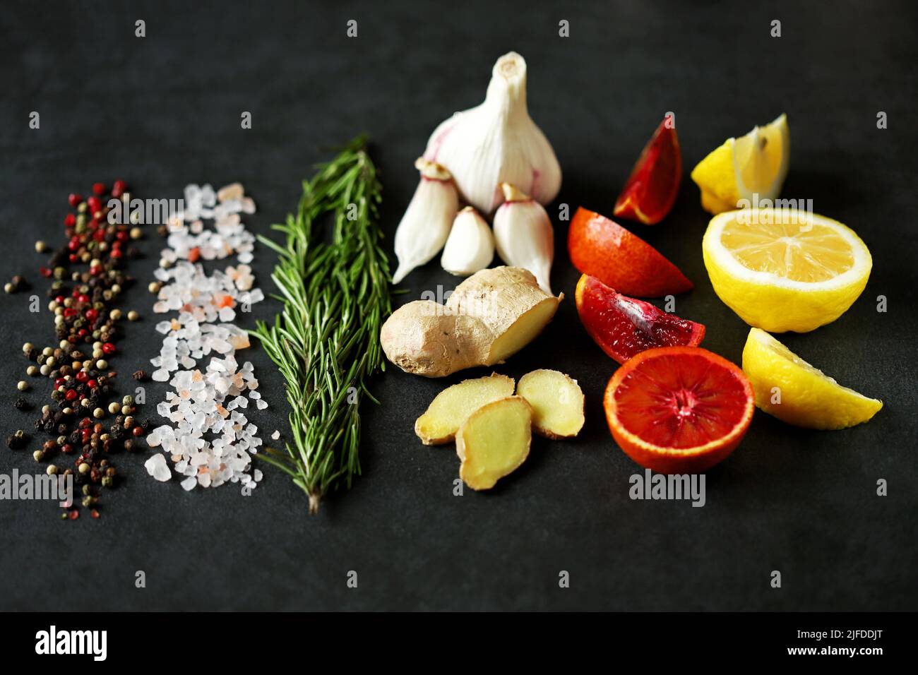 . Set spice on a black stone board. Peppers mix, Himalayan salt ...