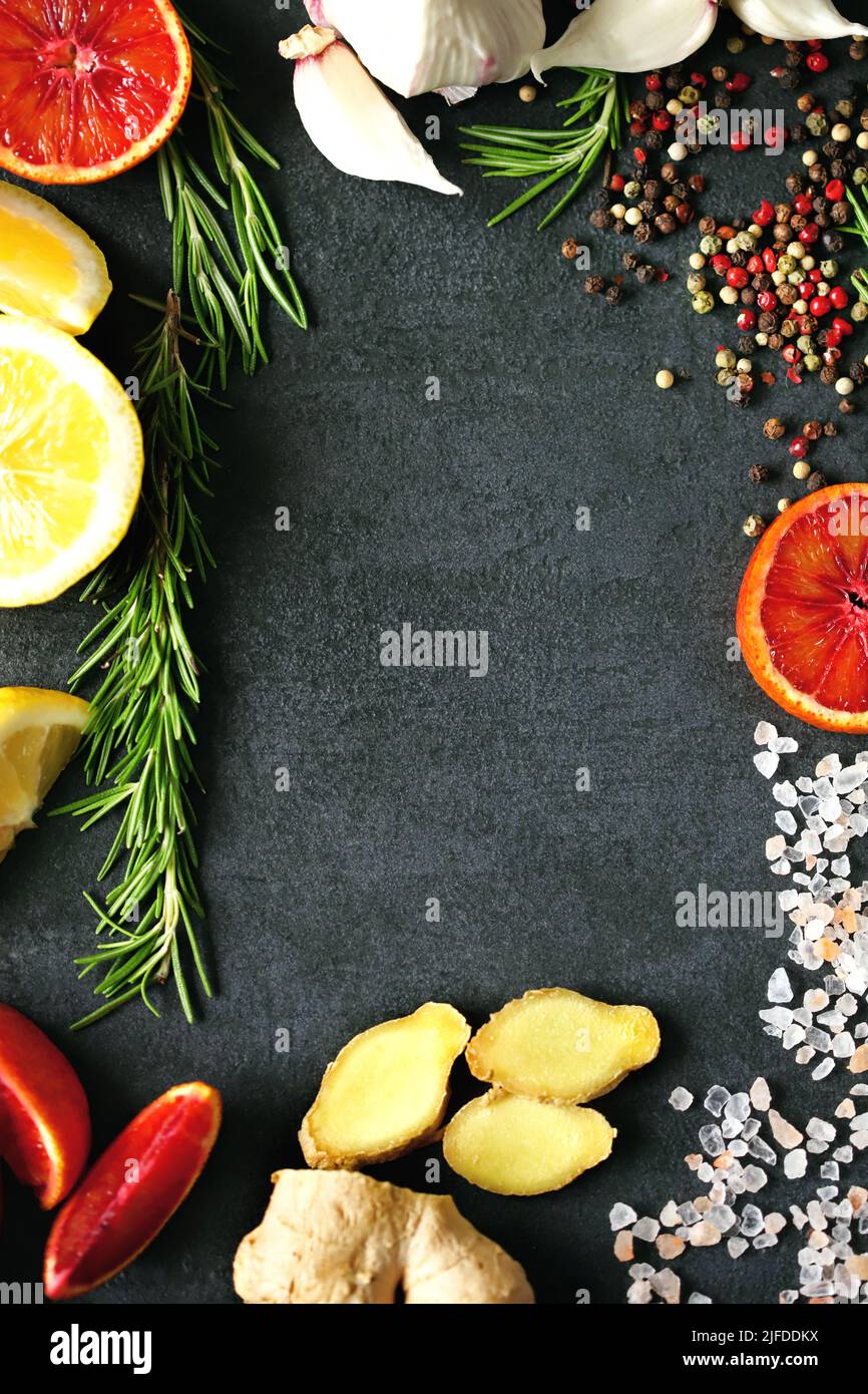 . Set spice on a black stone board. Peppers mix, Himalayan salt ...