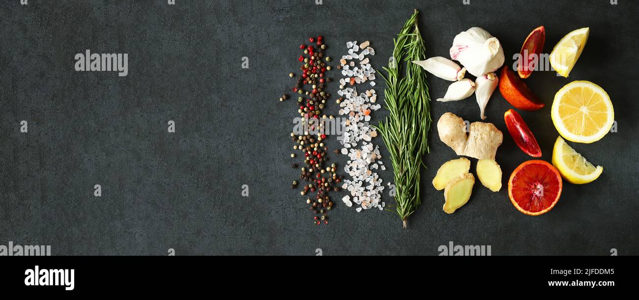 . Set spice on a black stone board. Peppers mix, Himalayan salt ...
