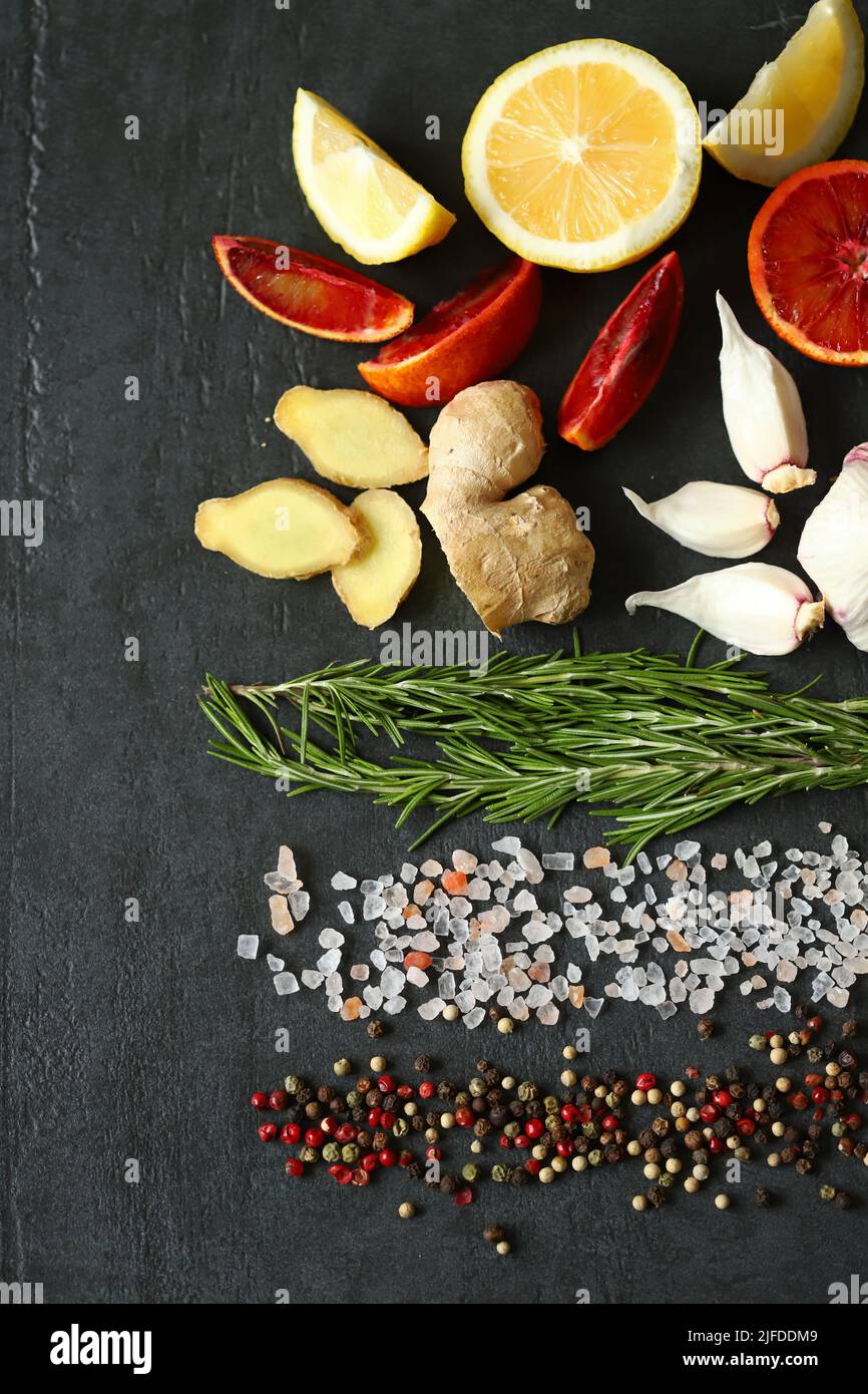 . Set spice on a black stone board. Peppers mix, Himalayan salt ...