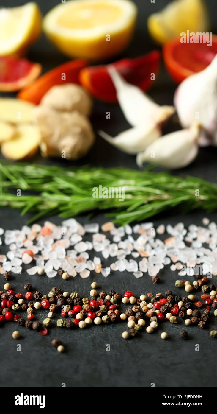 . Set spice on a black stone board. Peppers mix, Himalayan salt ...