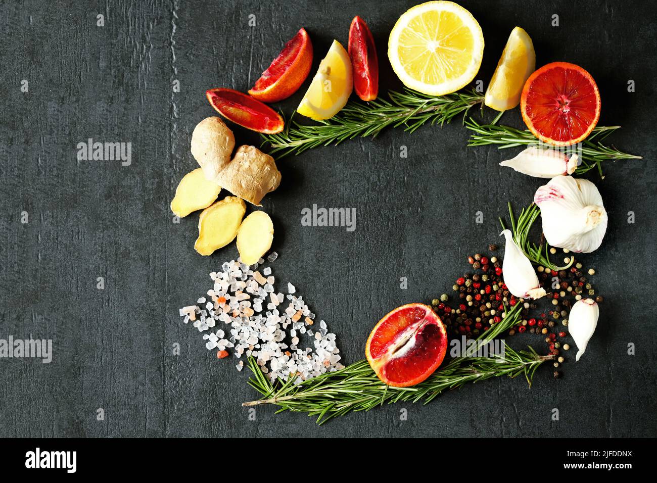 . Set spice on a black stone board. Peppers mix, Himalayan salt ...