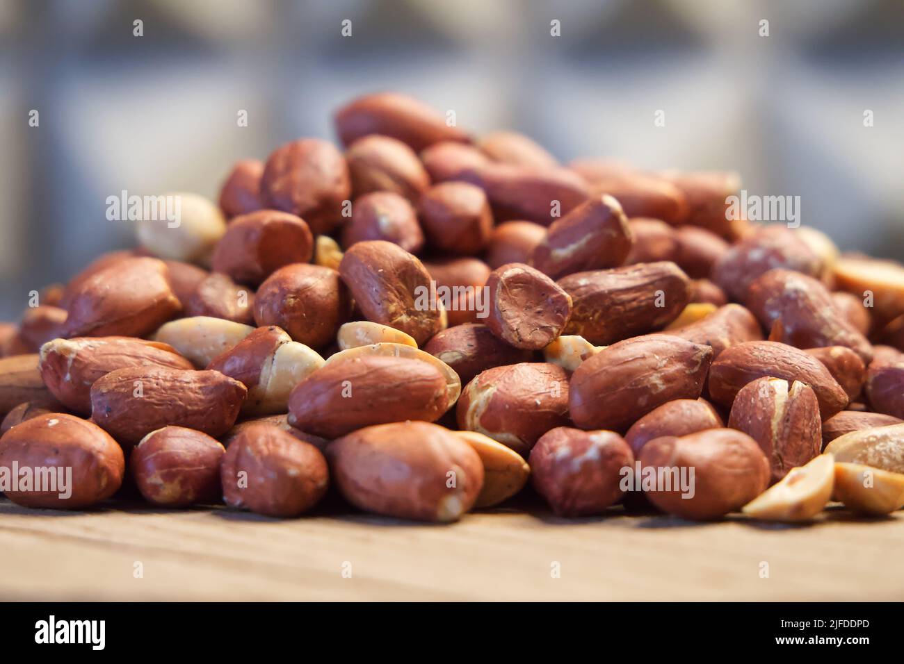 Heap of roasted peanuts, side view. Peanuts macro. Nuts. Peanuts peeled ...