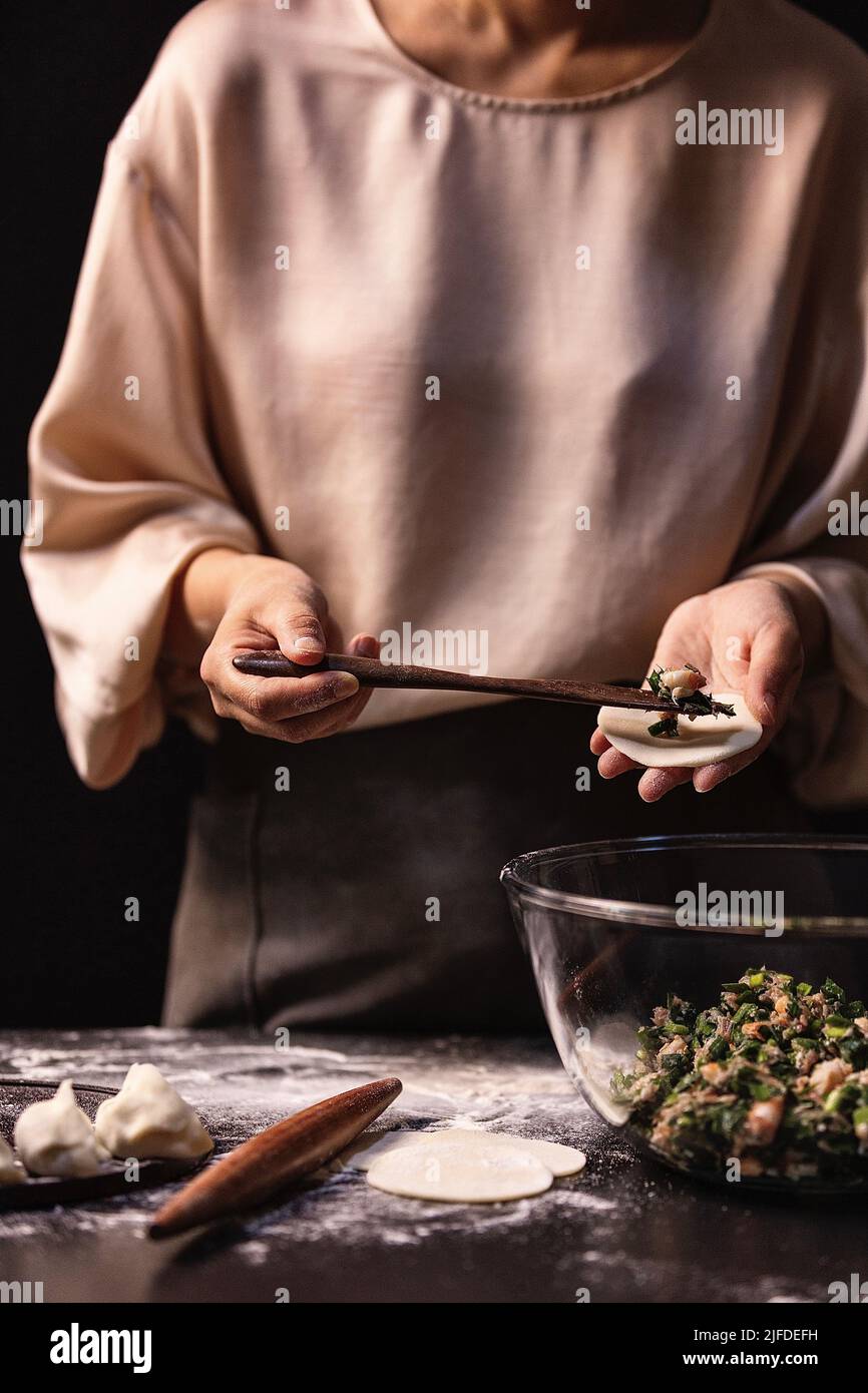 Wrapping dumplings, the process of making traditional Chinese food ...