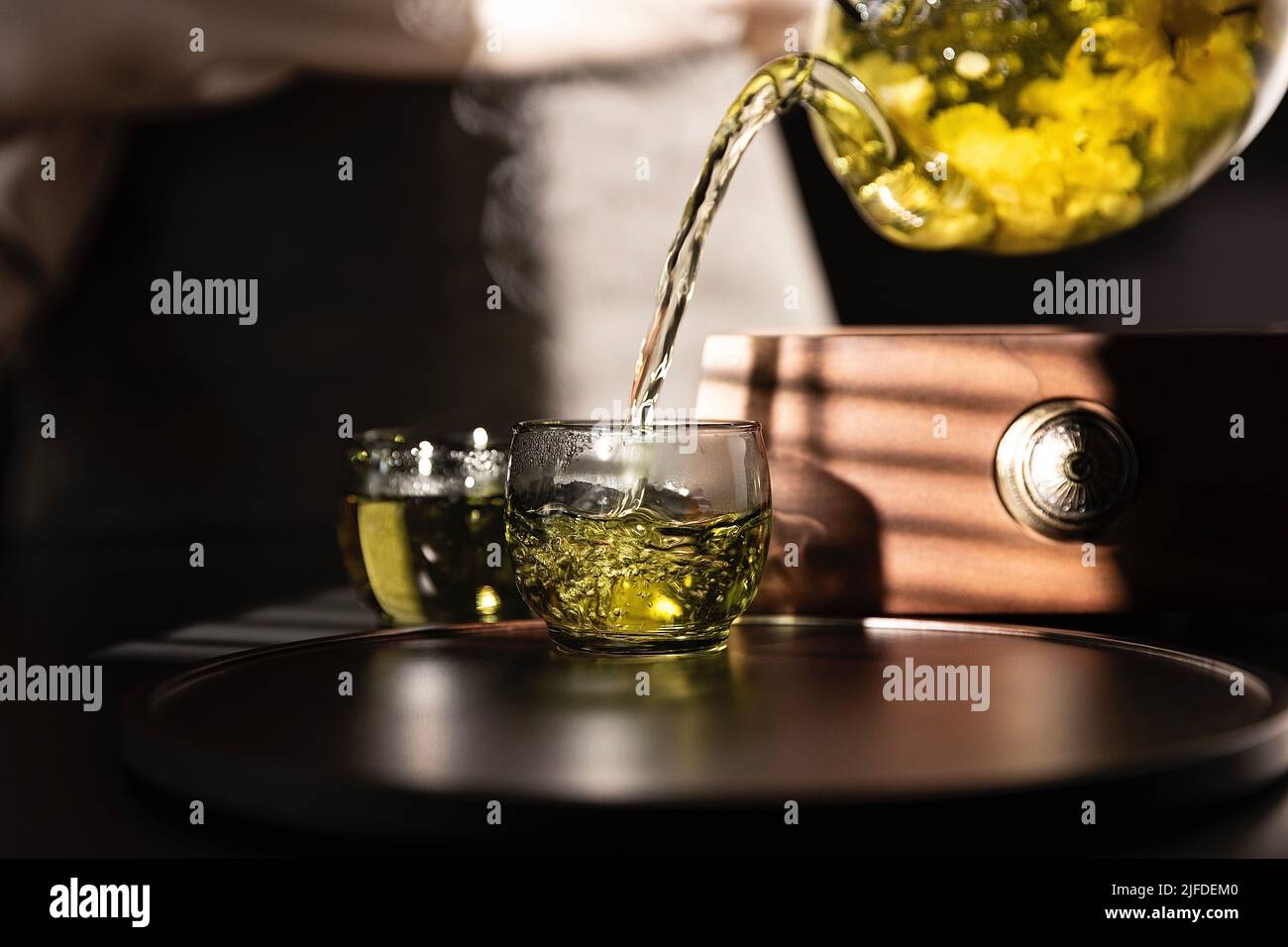 Chinese waiter pouring tea hi-res stock photography and images - Alamy