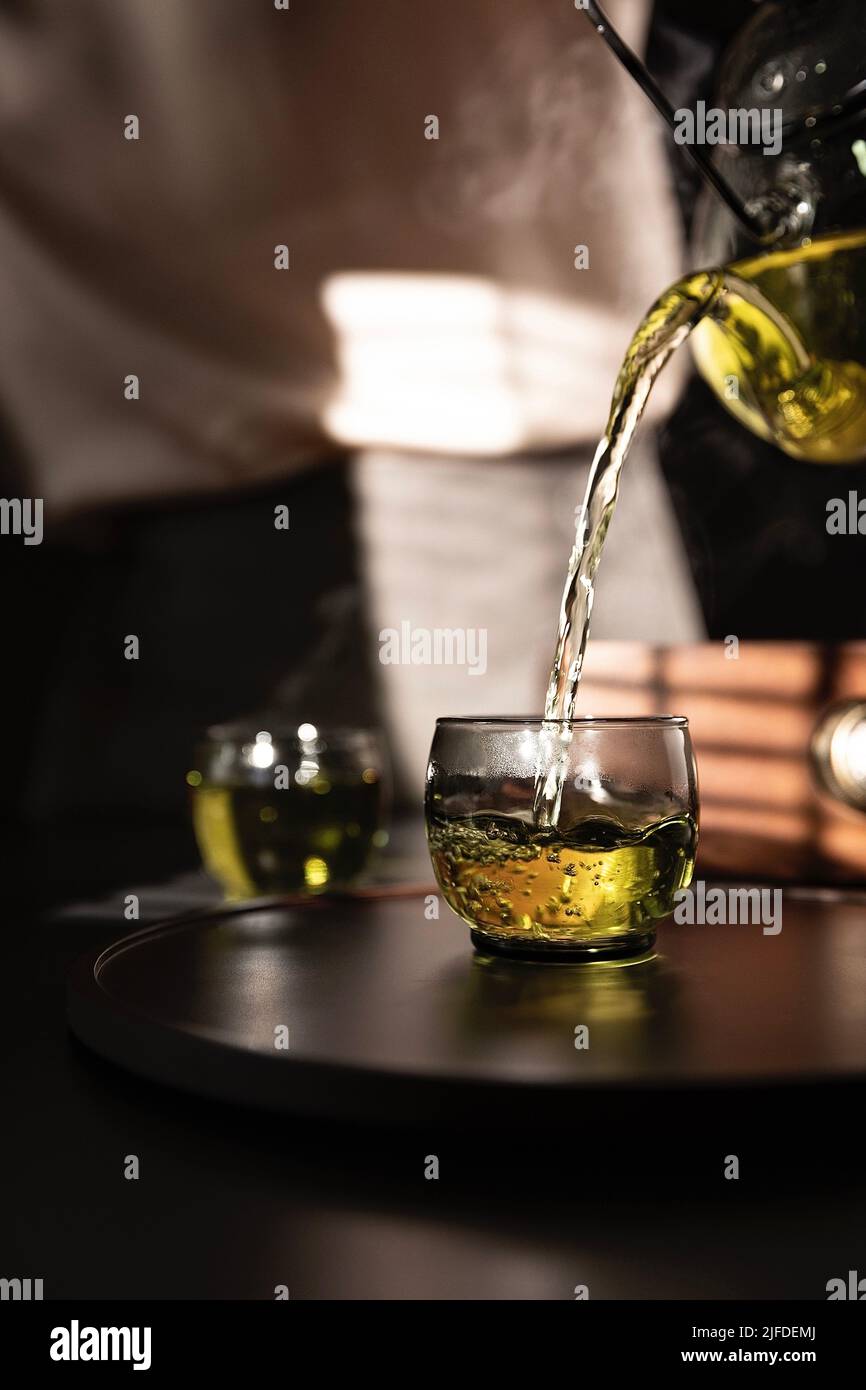 Chinese waiter pouring tea hi-res stock photography and images - Alamy