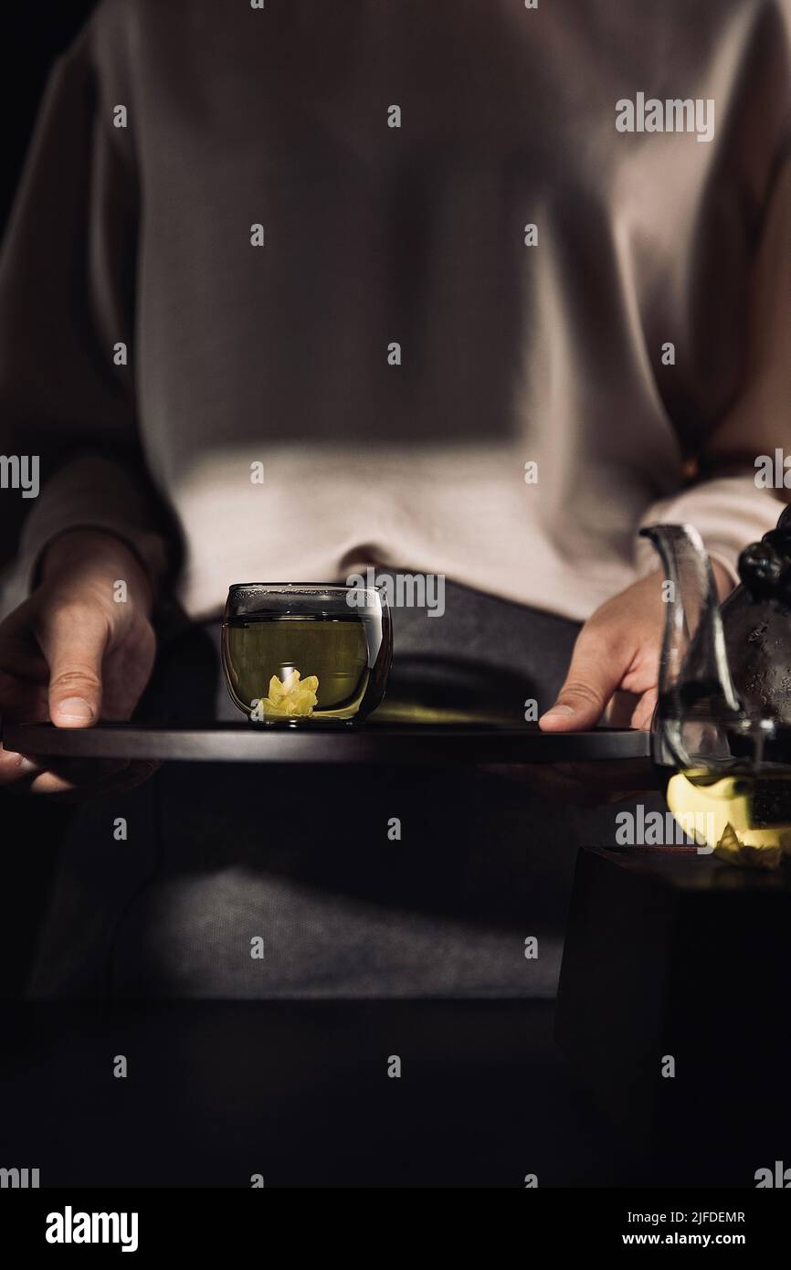 Tea artist serving pure jasmine tea, a traditional Chinese beverage ...