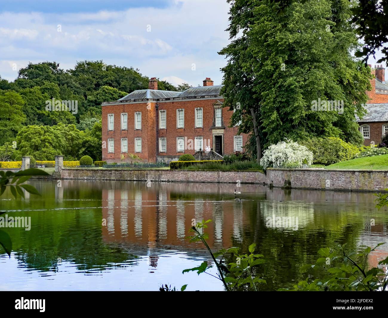 Dunham Massey Hall and moat in Greater Manchester, near Altrincham in ...