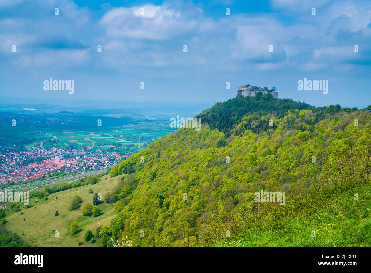 Germany, Hohenneuffen castle ruins on top of a forested mountain in ...
