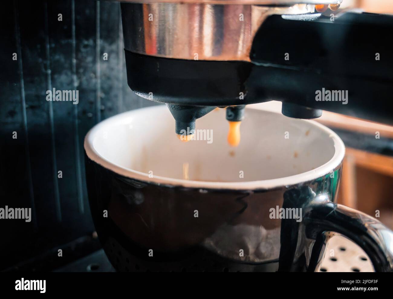 Fresh coffee drops falling cup hi-res stock photography and images - Alamy