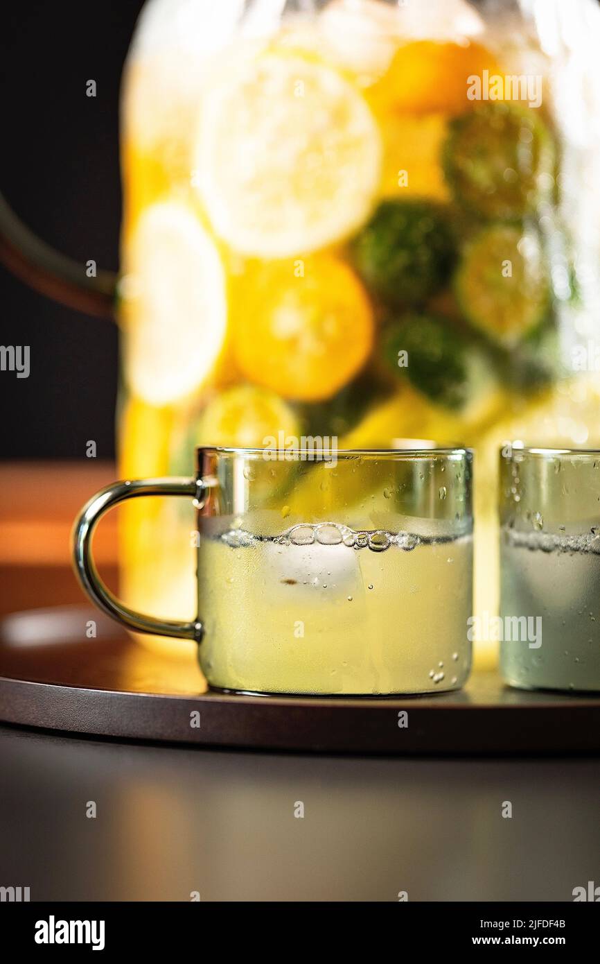 Chilled citrus fruit mix, cool and fruity cold drink making process ...