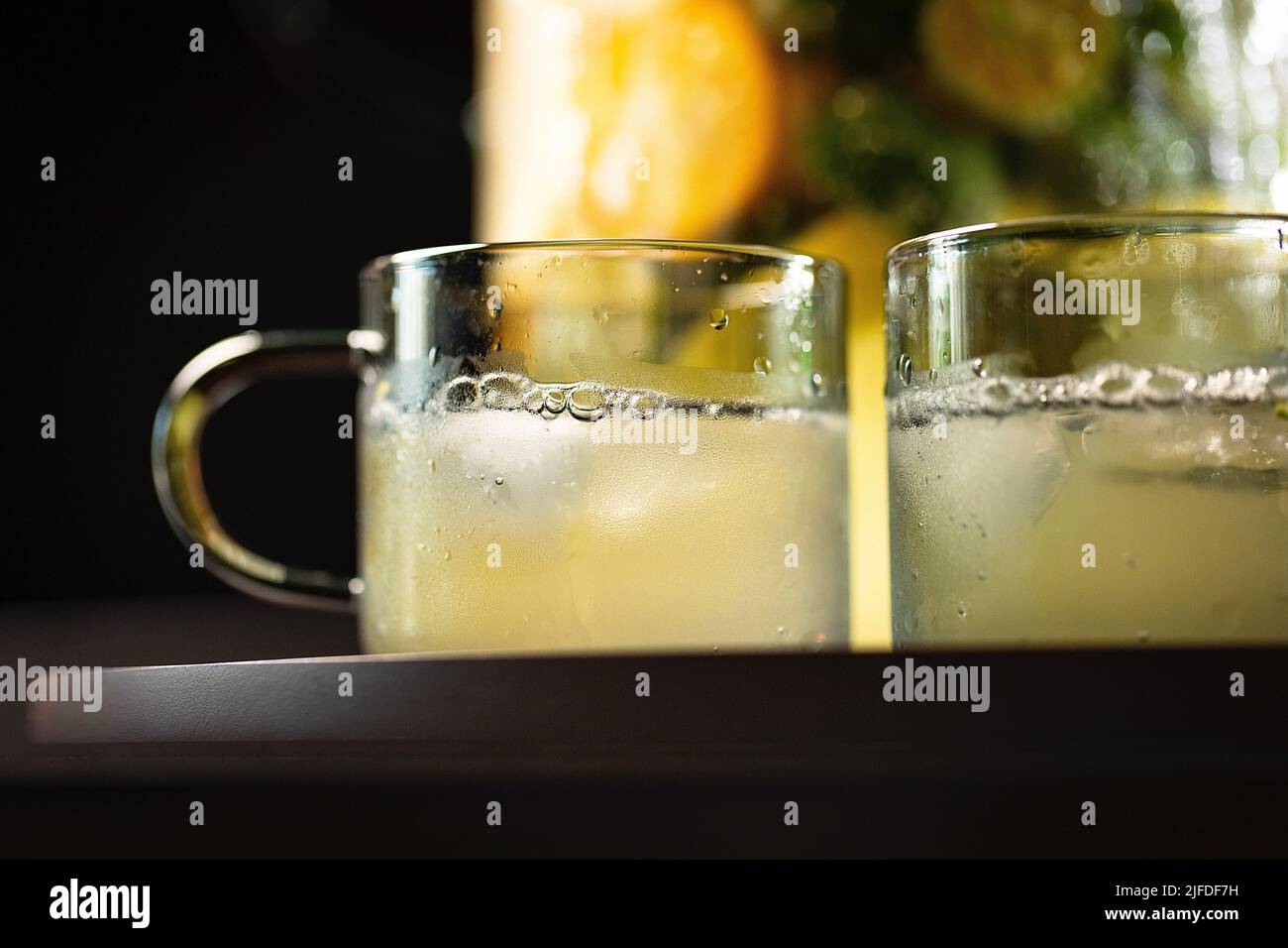 Chilled citrus fruit mix, cool and fruity cold drink making process ...