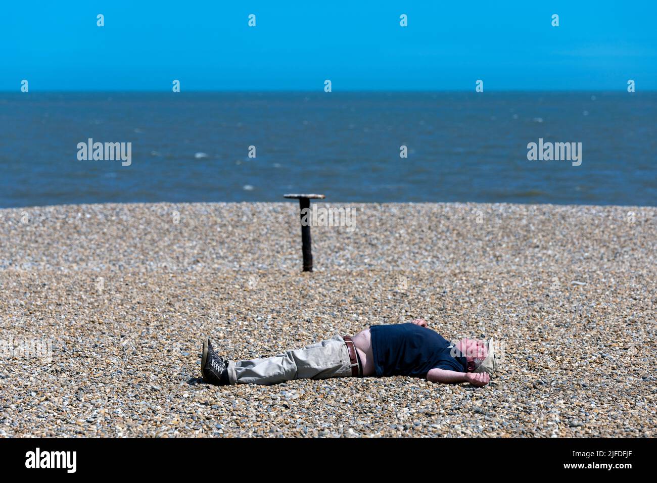 Men sunbathing at the beach man sunbathing at the beach hi-res stock ...