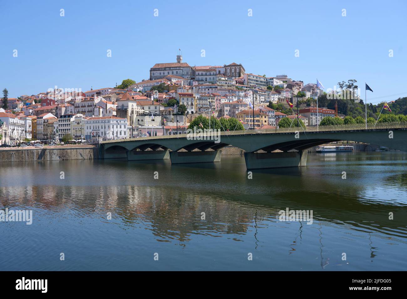 European Coimbra city and Santa Clara bridge over Mondego river at ...