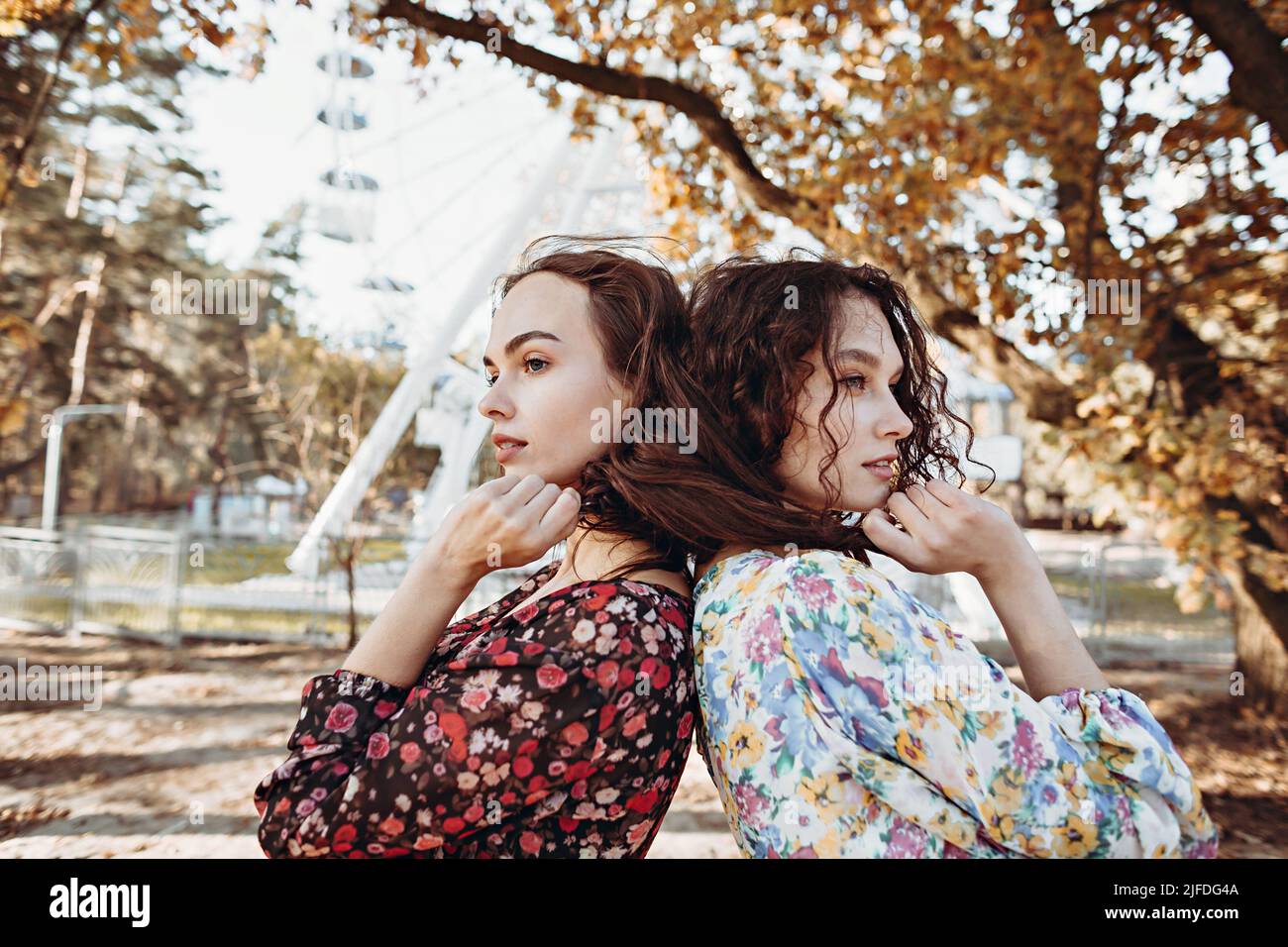 Two women laughing in park hi-res stock photography and images - Alamy