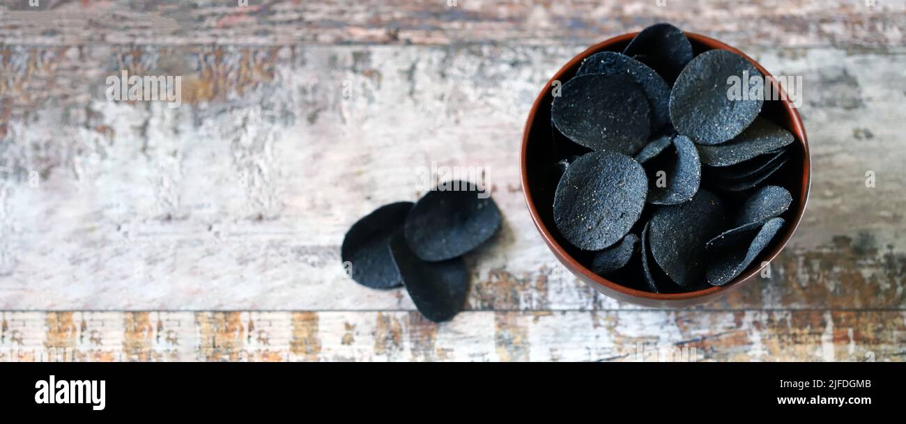 Black food. Black chips. Black food trend. Cuttlefish ink food Stock ...