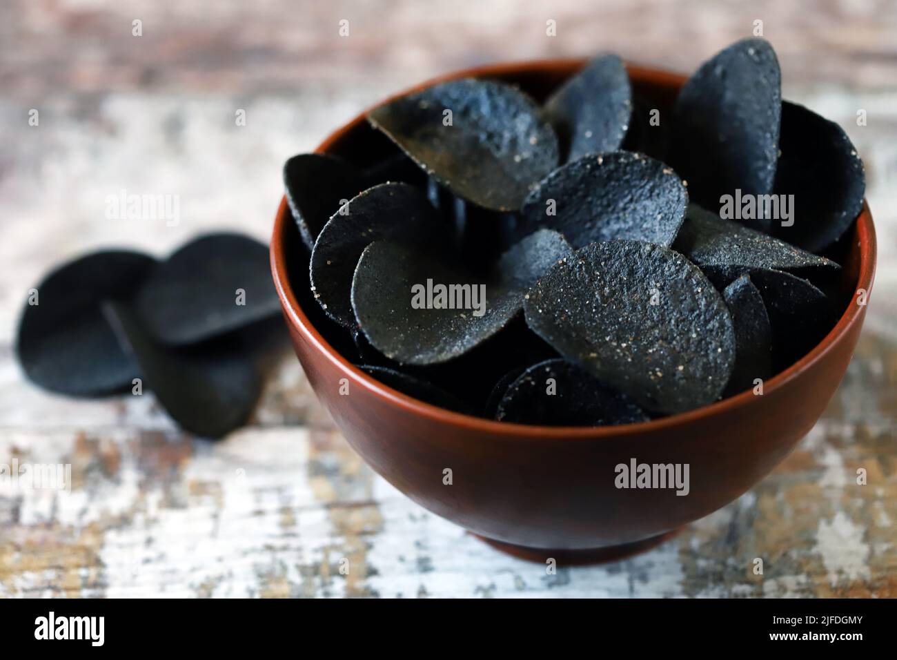 Black food. Black chips. Black food trend. Cuttlefish ink food Stock ...