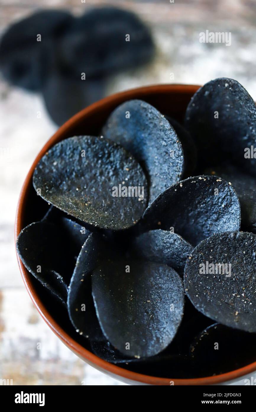 Black food. Black chips. Black food trend. Cuttlefish ink food Stock ...