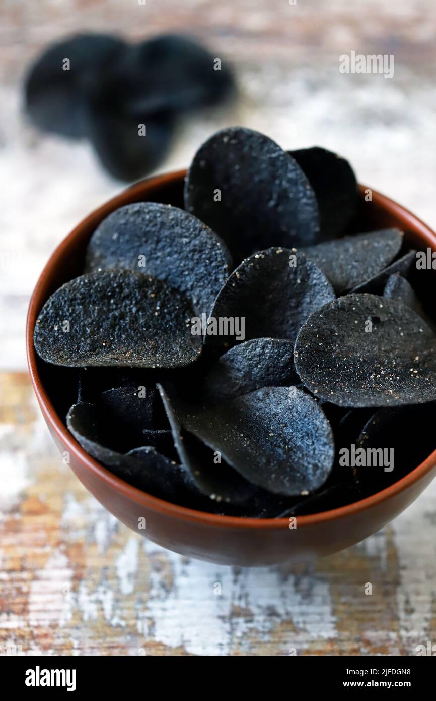 Black food. Black chips. Black food trend. Cuttlefish ink food Stock ...