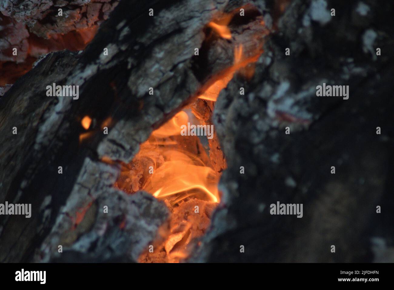 Fire inside a wooden log burning Stock Photo - Alamy