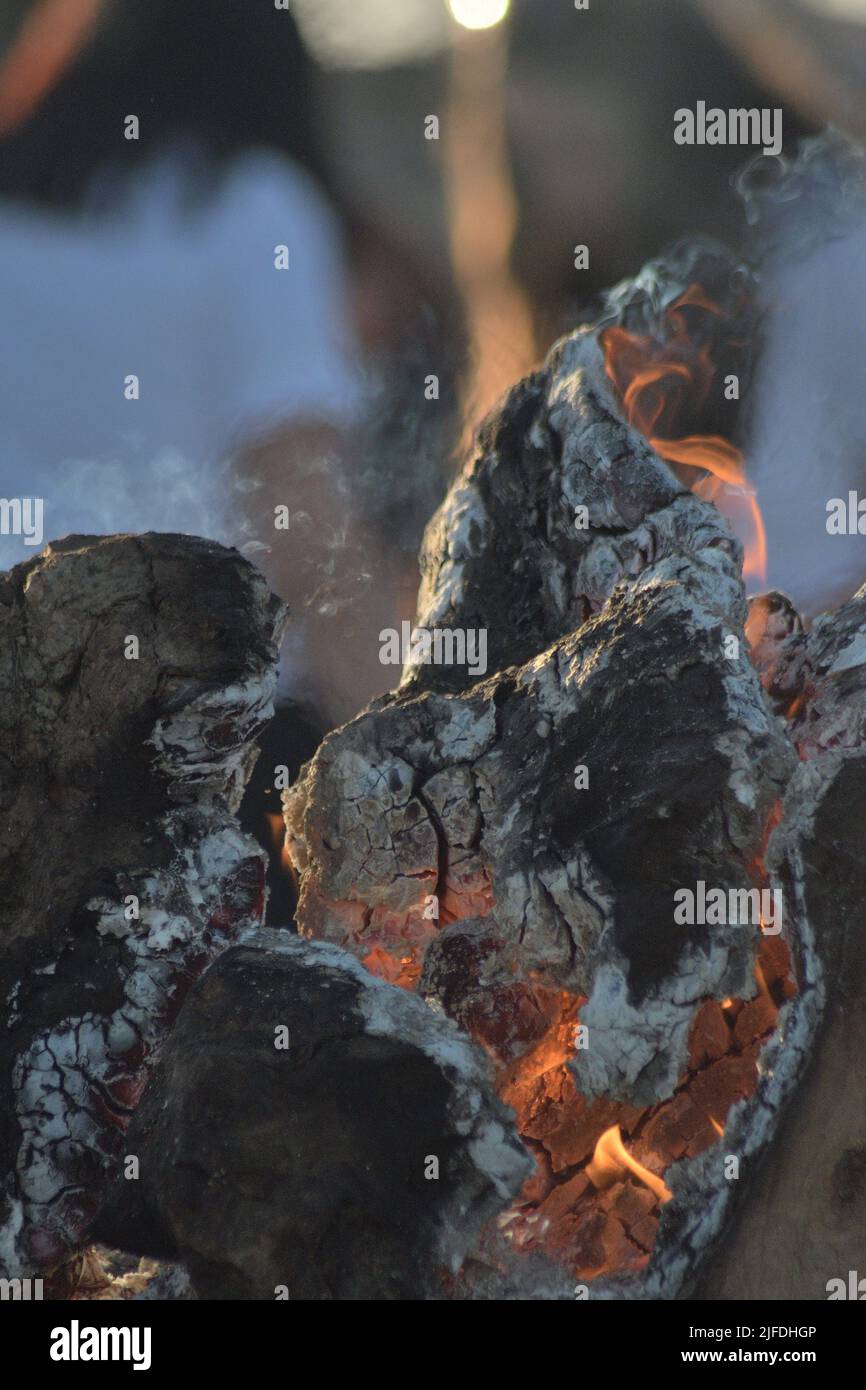 Wooden logs burning in a bonfire Stock Photo - Alamy