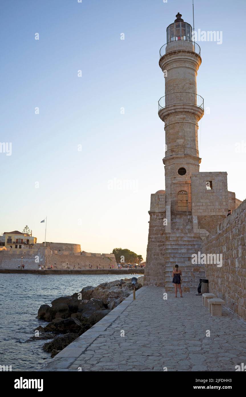 The lighthouse in the old Venetian harbour of Chania, Crete Stock Photo ...