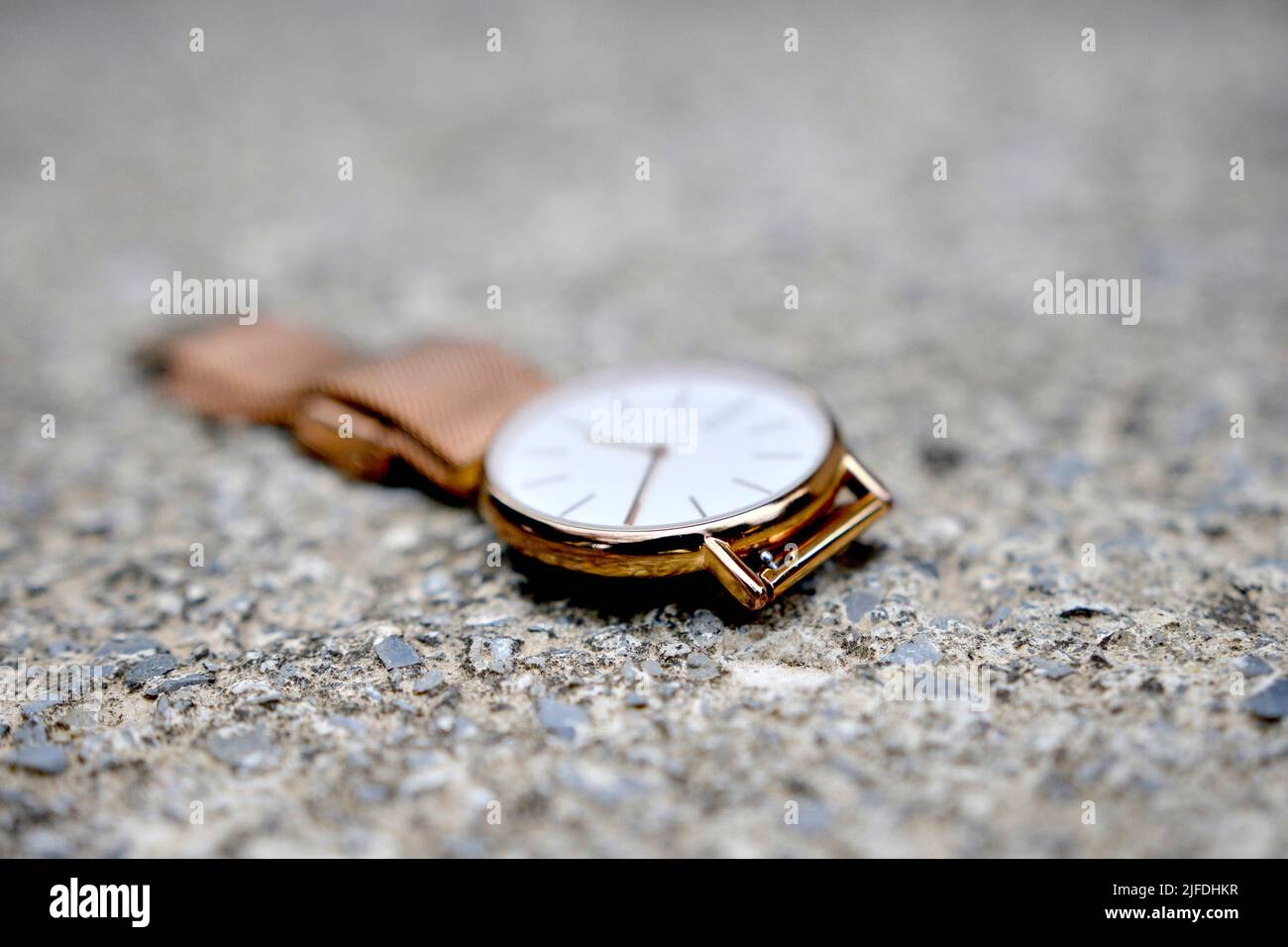 men's watch shot a on a concrete background Stock Photo - Alamy