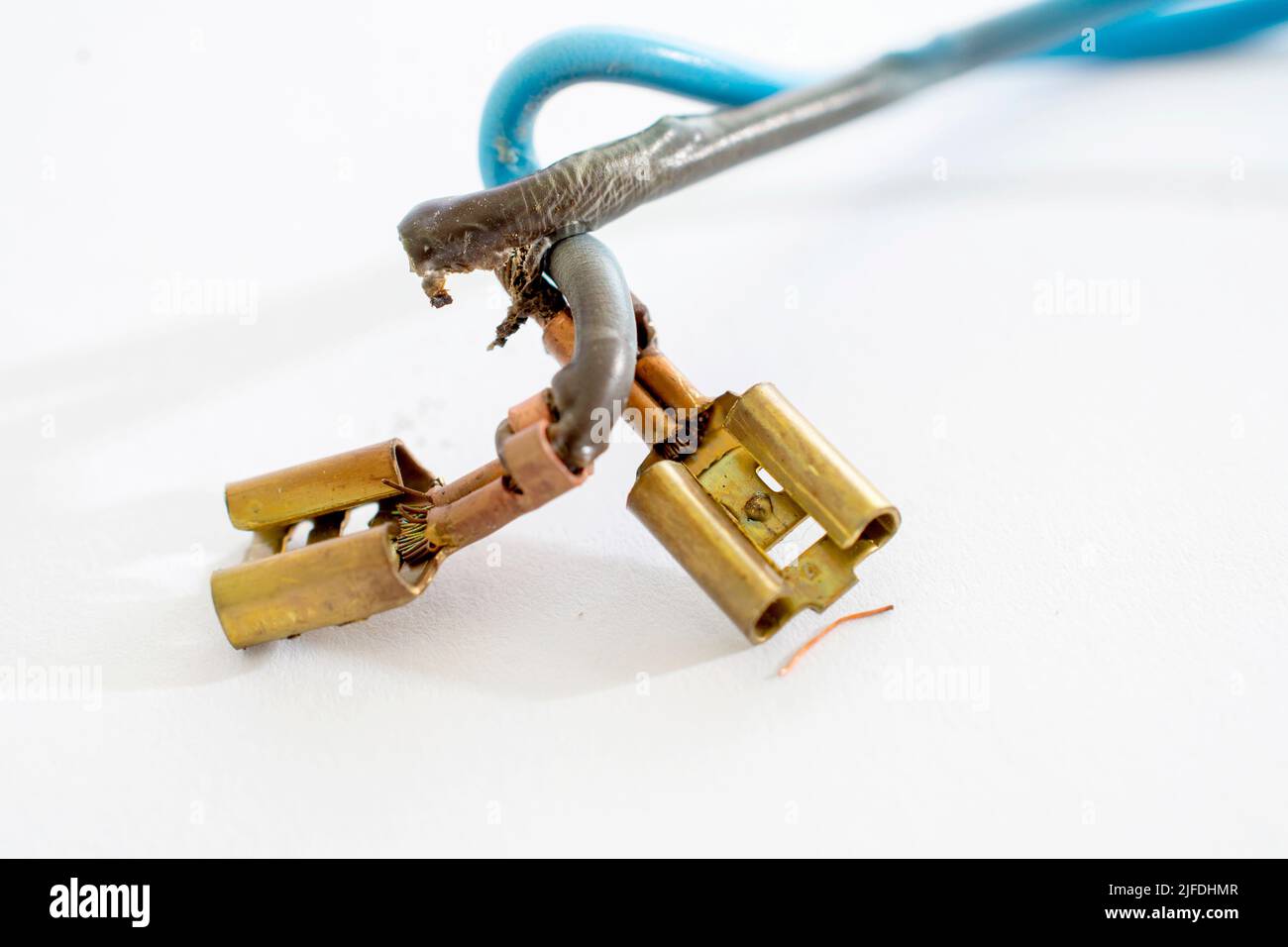 Old twisted copper cable on white Stock Photo - Alamy